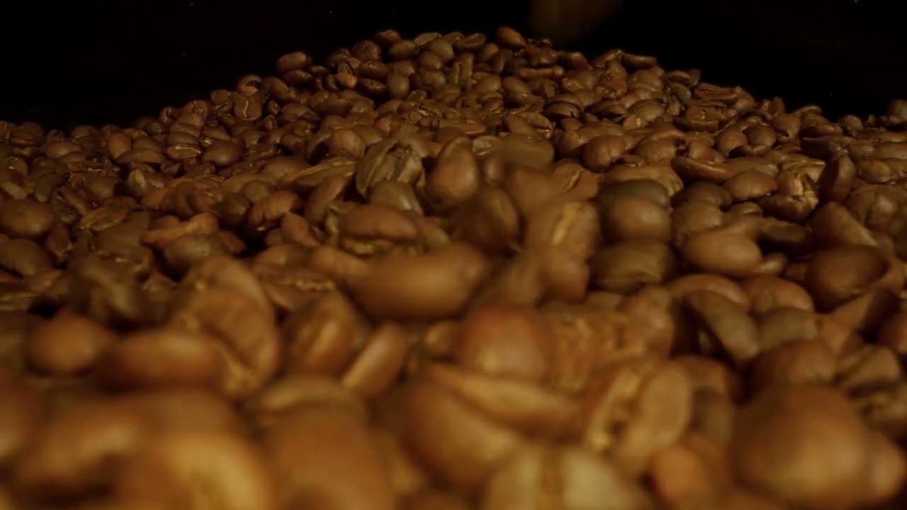 many coffee beans on a black background 4k