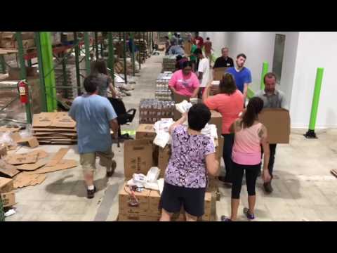 Food Bank volunteers pack boxes for the CSFP