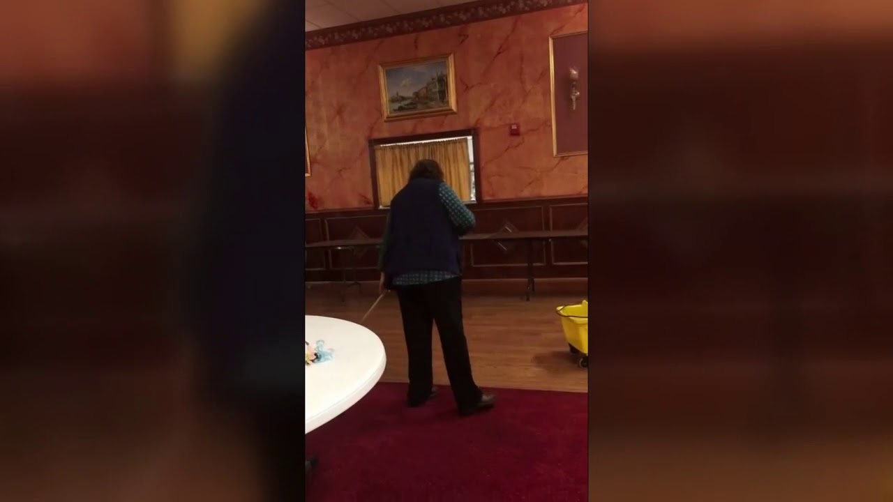 Woman caught on camera mopping tables after floor at Parma party center