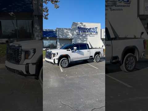 Gloss black vinyl wrap on top half of this GMC Sierra truck for a bold, high-contrast look