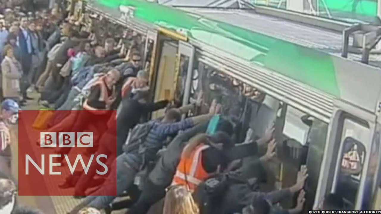 Train rescue: Passengers tilt train to free trapped man in Australia - BBC News