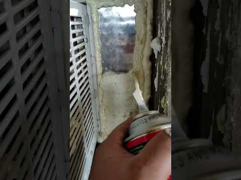 Foam insulation around a window unit aC
