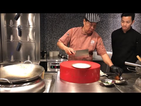 Chef Jian Chit Ming prepares amazing chicken wing filled with shrimp at 2 star Canton 8 in Shanghai