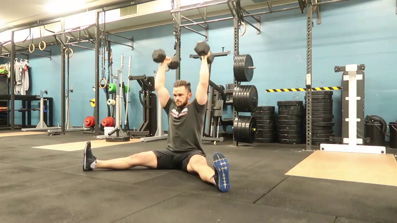 Straddle Overhead Dumbbell Press