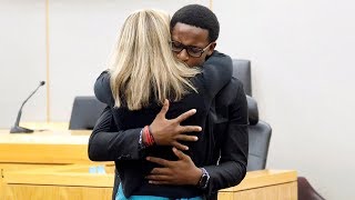 Brother of man shot dead by ex-Dallas police officer forgives and hugs ...