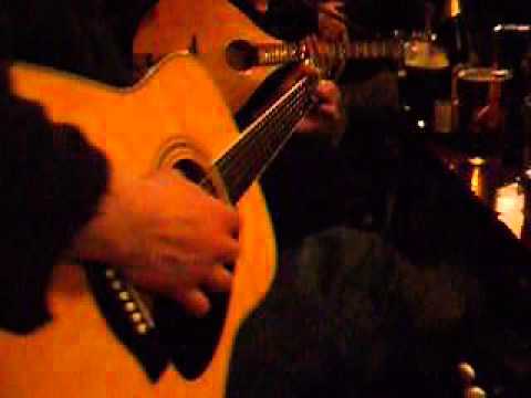 Irish traditional music session doolin o'cornars pub 050227guiter1