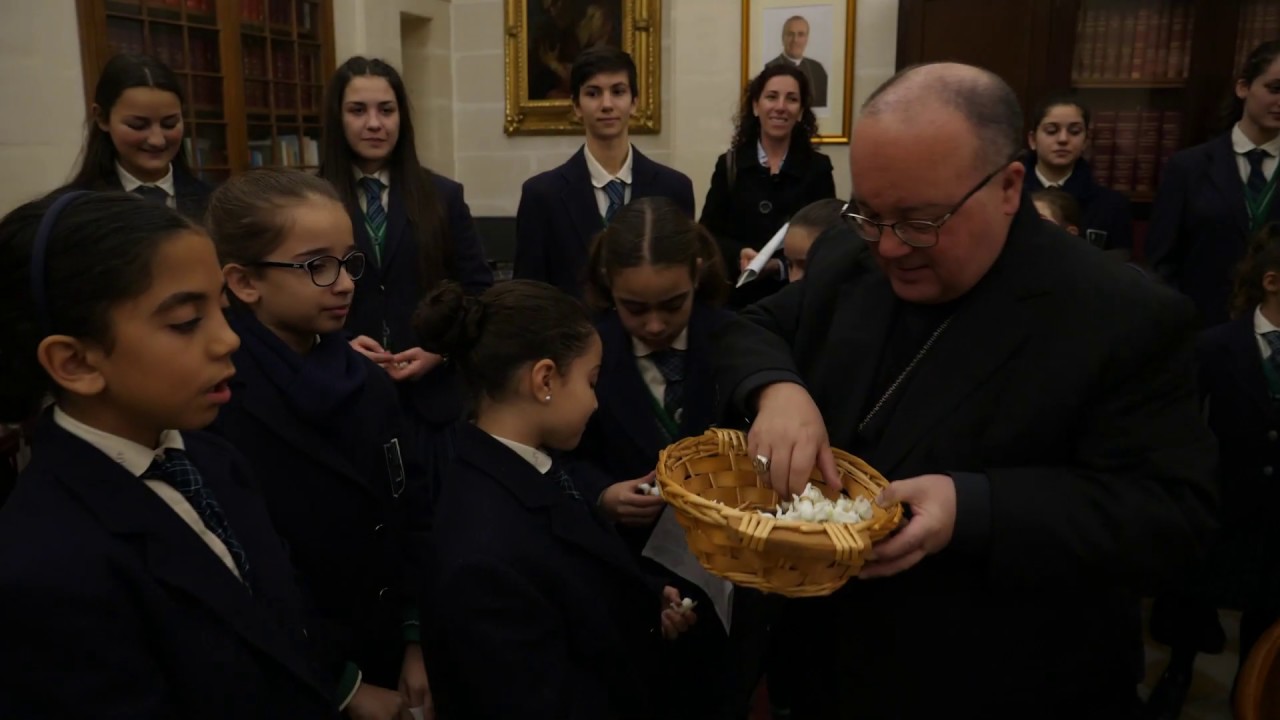 Students sing Christmas carols at the Archbishop's Curia