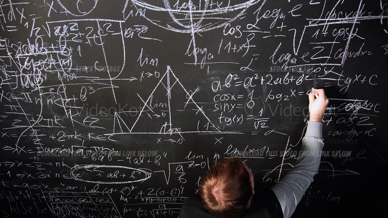 Top view footage of professor writing algebra formulas on blackboard