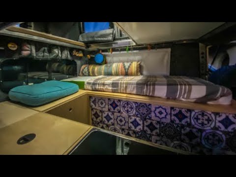 Truck topper with kitchen, toilet and desk.