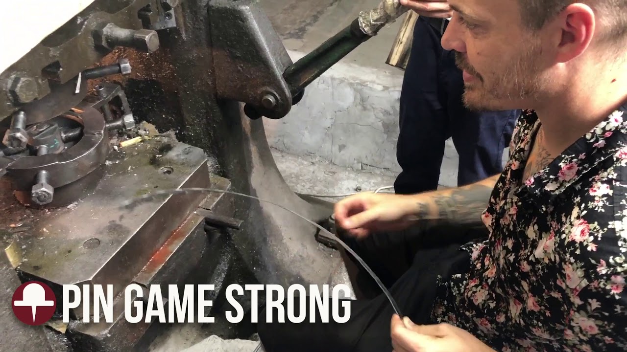 Stamping Pins in Iron from a Mold - How pins are made - Pin Game Strong