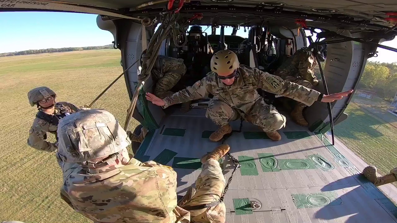 Rappelling out of a Black Hawk