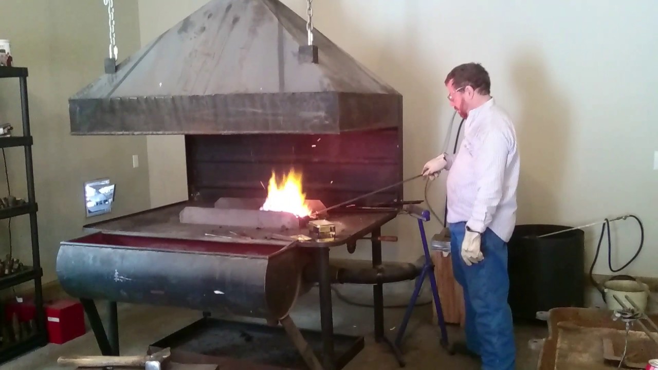 Bill and Robert blacksmithing at the forge
