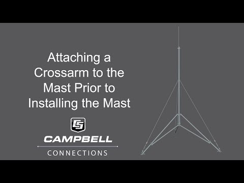 Assembling the mast on the ground: Attaching the crossarm to the...