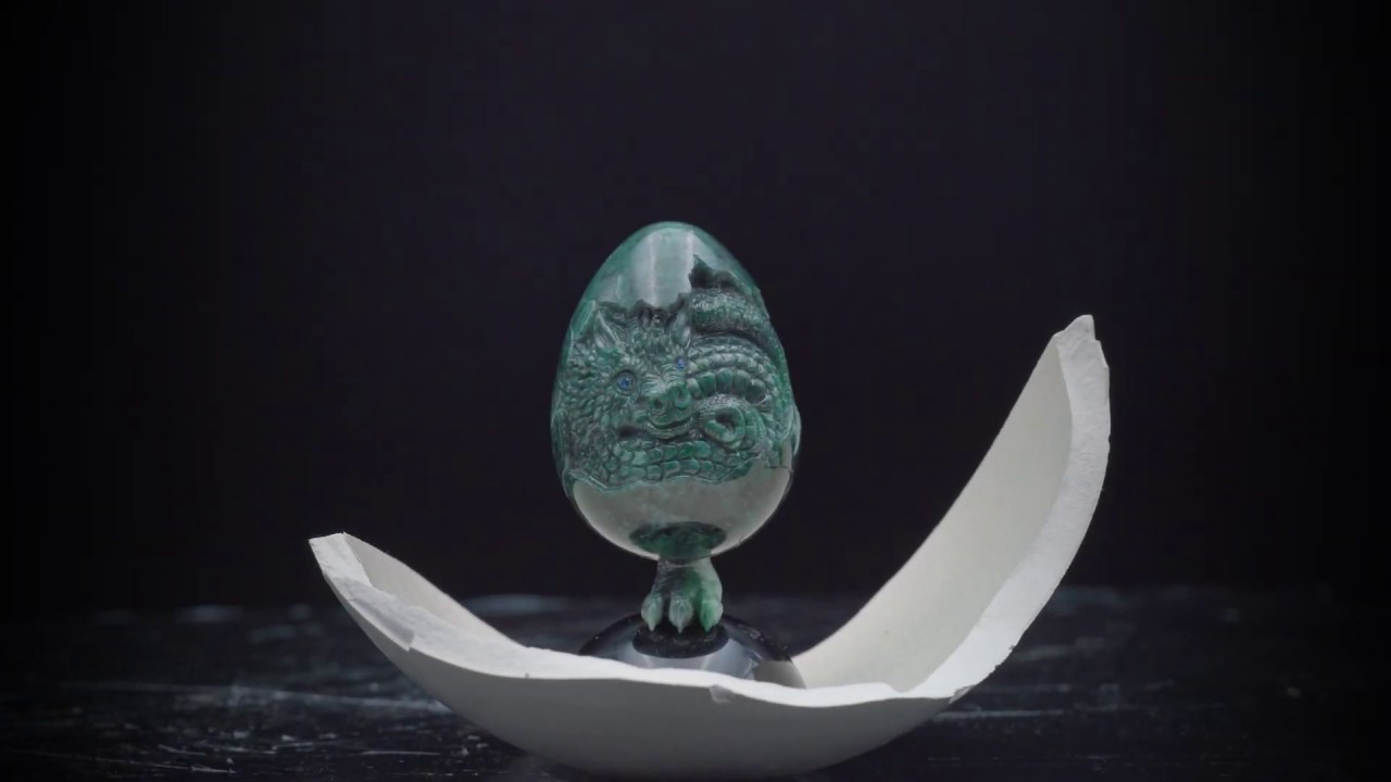 Artemis - Engraved jadeite egg on obsidian pedestal