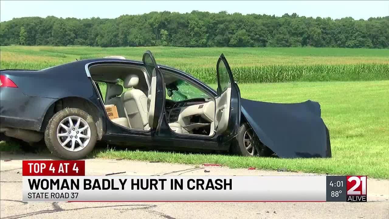 Woman in critical condition after crash with semi