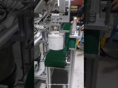 Automatic tissue paper roll making cutting machine with discharge conveyor