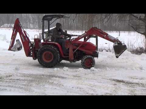 KUBOTA B20 4X4 COMPACT TRACTOR WITH LOADER, BACKHOE, AND CANOPY