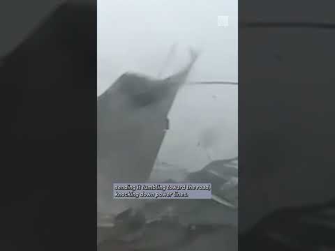 Warehouse gets blown into oncoming car during storm | #shorts #Thailand #weather