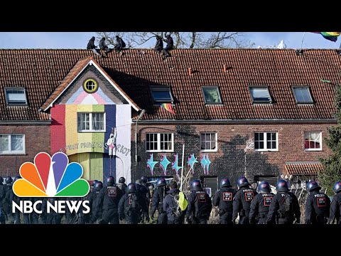 Police begin to clear climate change activists from German village earmarked for demolition