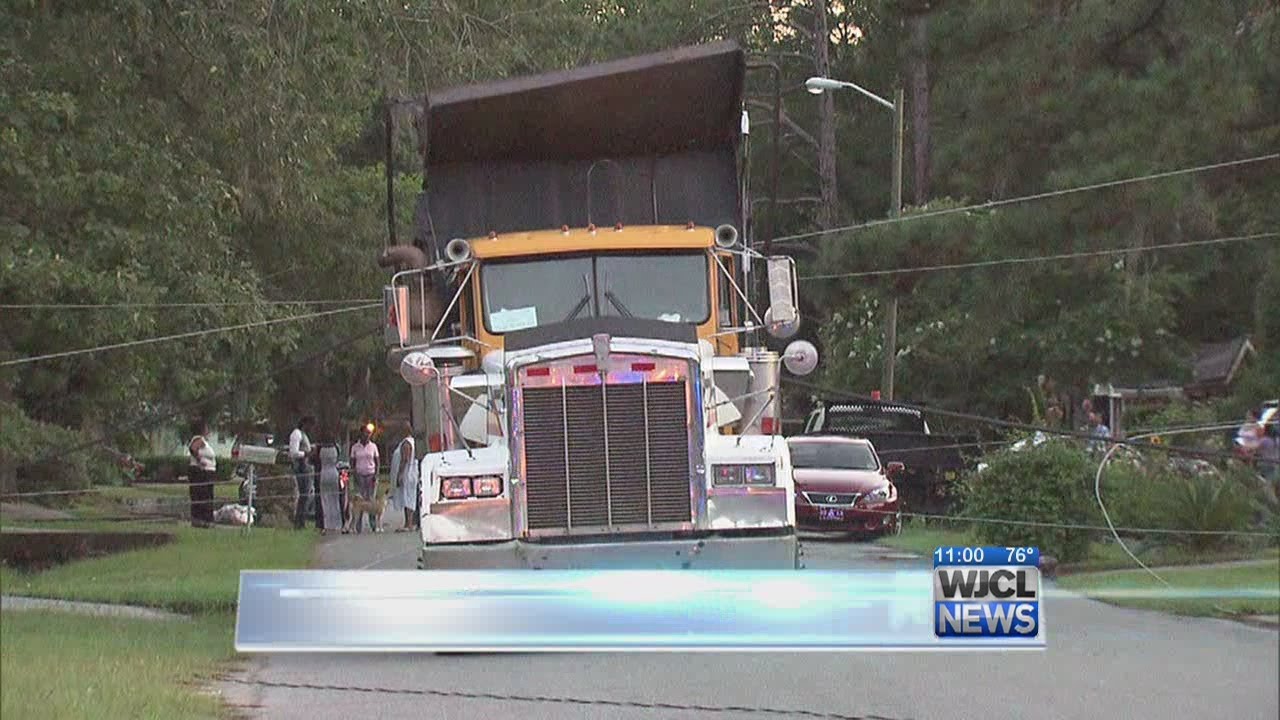 Dump truck pulls down power lines and poles