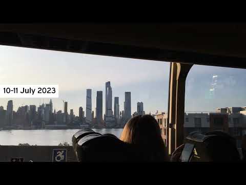 New York:Trailways bus arriving West NY looking out Manhattan skyscrapers in the sunrise backlight