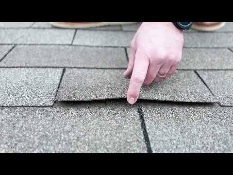 Why are shingles curling and nails popping on your roof?