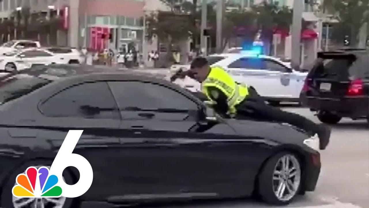 Miami Police officer seen shooting driver while on hood of moving car in wild video