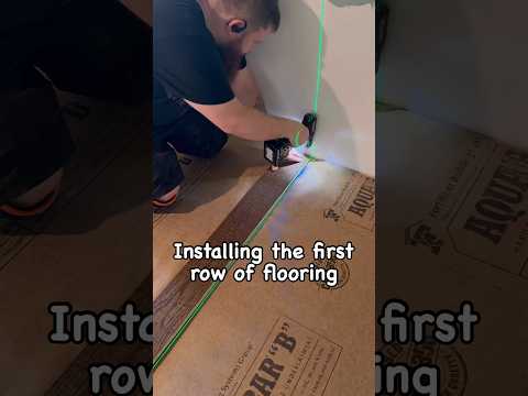 Installing the first row of hardwood flooring #flooring #construction #diy