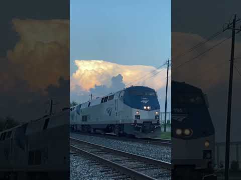Amtrak number one under photogenic clouds