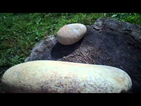 Tan slanted metate and mano.AVI