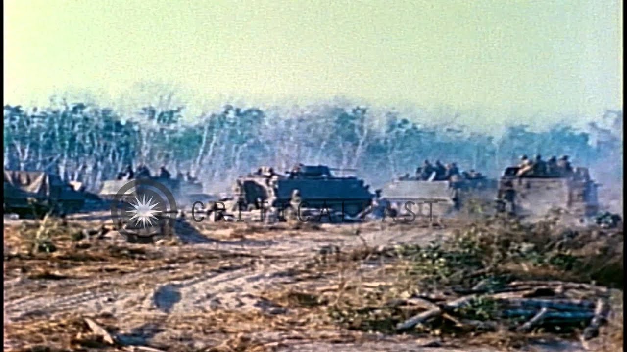 US 1st Infantry Division soldiers follow M-113 APCs (Armored Personnel Carrier) i...HD Stock Footage