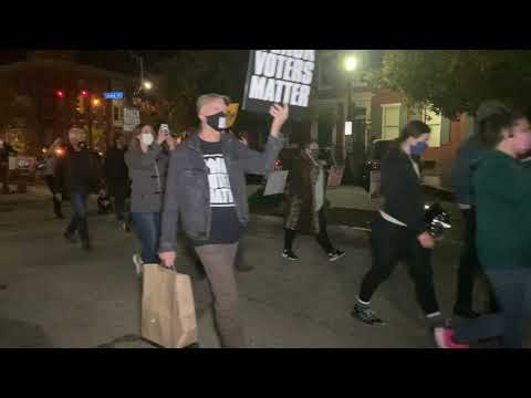 Voters march in front of state capitol for rally to count every vote and protect the results
