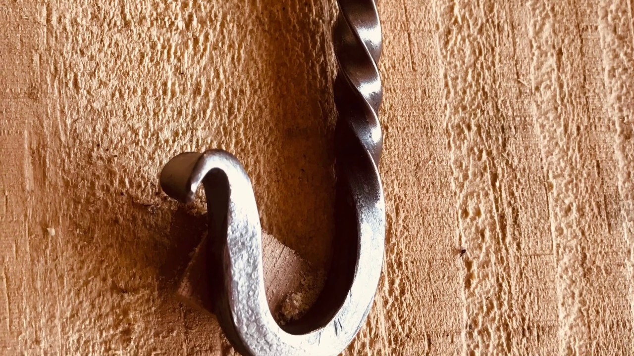 Blacksmith Forging A Simple J-Hook With A Twist