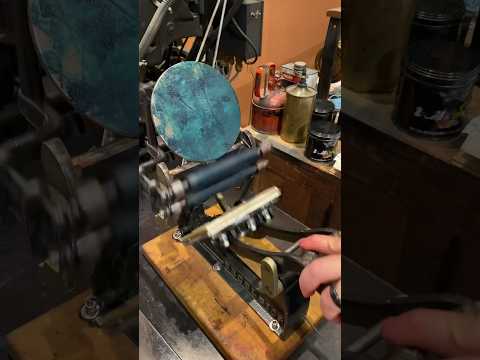 Letterpress printing birthday greeting cards in green ink with a tabletop printing press
