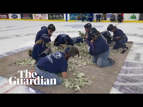 South Dakota teachers scramble for dollar bills to buy classroom supplies in half-time game