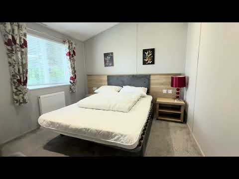 10094B – Bure Village area, 2 bed, 4 berth lodge with decking
