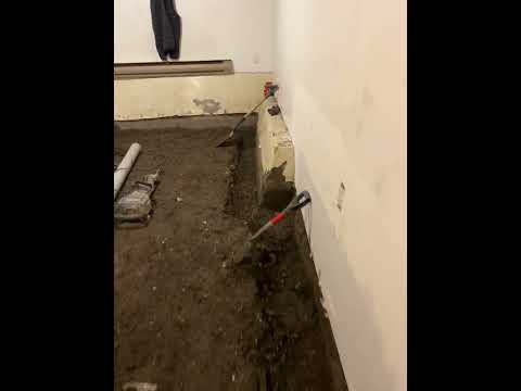 Interior basement manual excavation job and preparation for french drains