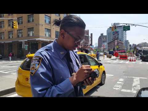 Traffic agent Harris gives a ticket on a red light