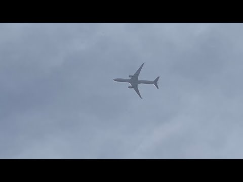 Air China Boeing 777W [B-2039] emerging through the clouds
