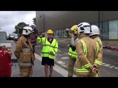 DCO Iain Bushell welcomes Minister Annabelle Ewing to scene of Glasgow School of Art fire