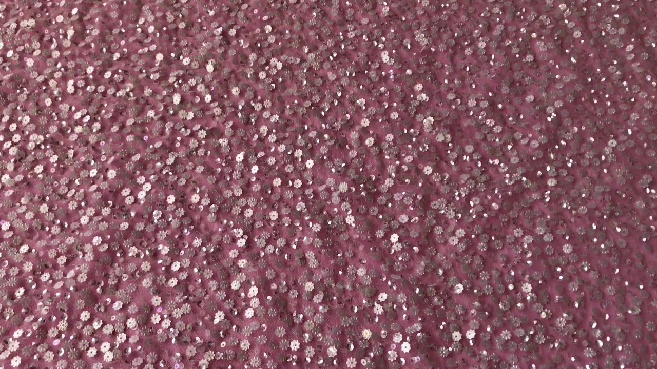 An ivory Sequinned Tulle with a variety