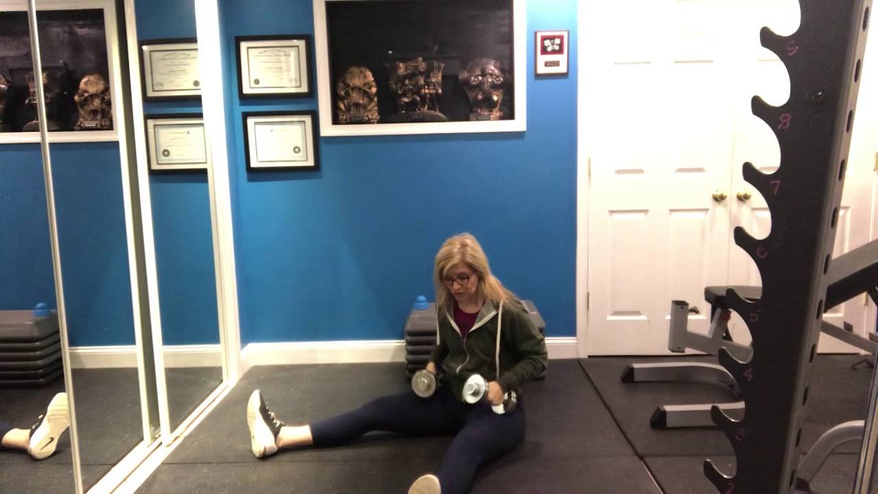 Seated Straddle Overhead Press