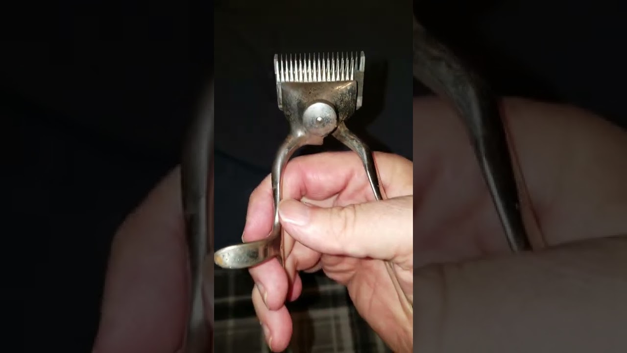 Old manual clippers. Vintage hair cutting sheers that say 