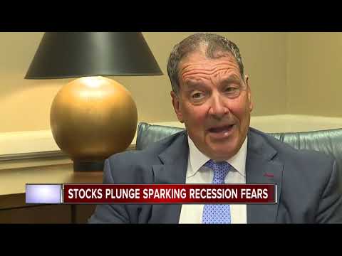Dow tumbles 800 points after bond market flashes a recession warning
