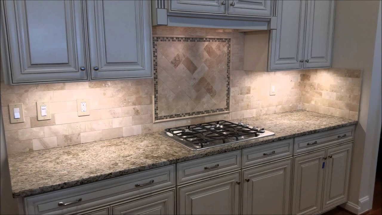 Travertine Backsplash with Herringbone Inlay