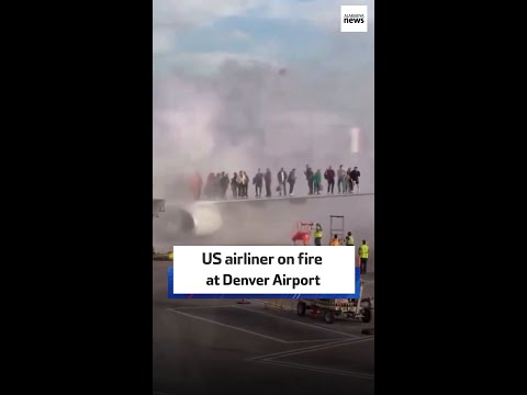 US airliner on fire at Denver Airport