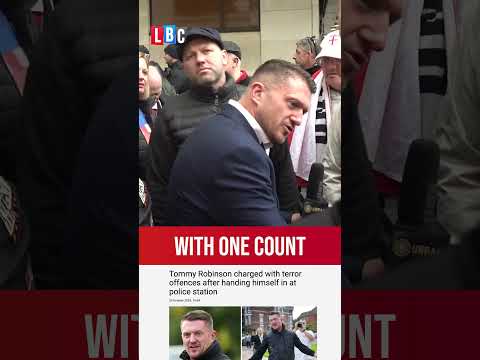 Tommy Robinson charged under Terrorism Act as he hands himself into police | LBC