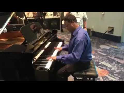 Kris Nicholson test driving a C. Bechstein Grand piano in Anaheim California Namm 2019