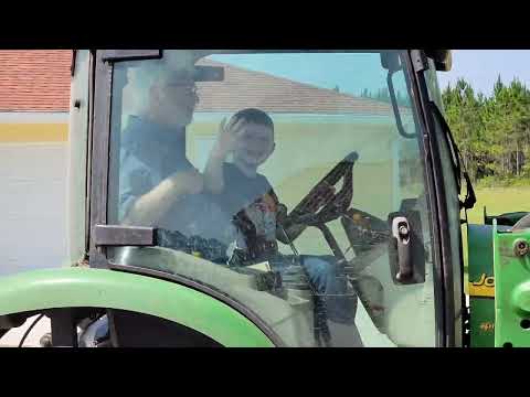 Jack driving a John Deere tractor 🚜