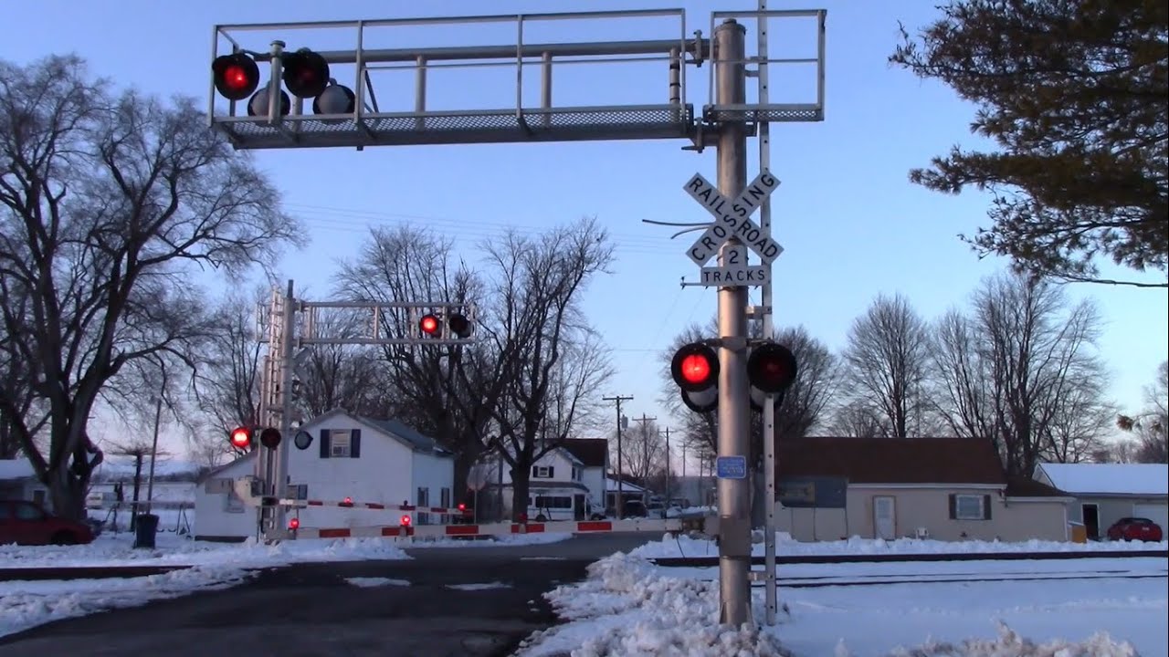 Main Street Railroad Crossing -  BNSF 7603, NS 1151, BNSF 7834, and NS 1027 in Clymers, Indiana